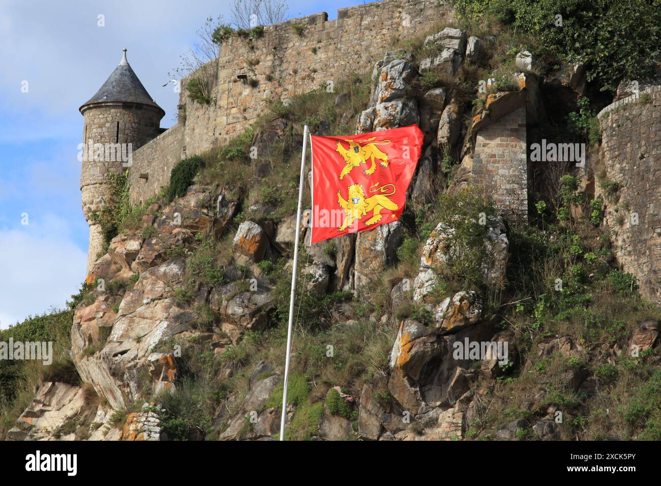 The Norman flag waving outside of the Mont-Saint-Michel in Normandy ...