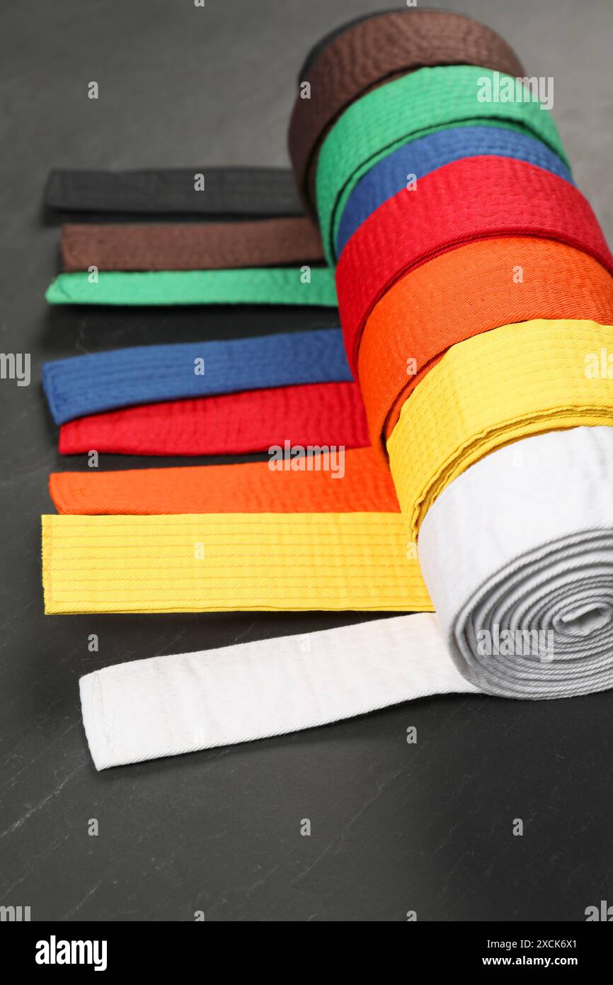 Colorful karate belts on gray background, closeup Stock Photo - Alamy