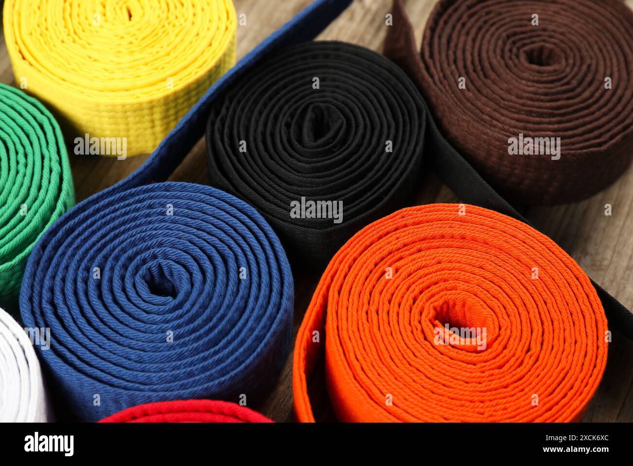 Colorful karate belts, closeup. Martial arts uniform Stock Photo - Alamy