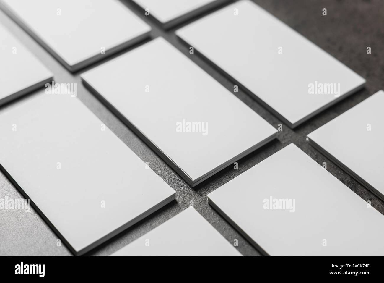 Blank business cards on grey textured table, closeup. Mockup for design ...