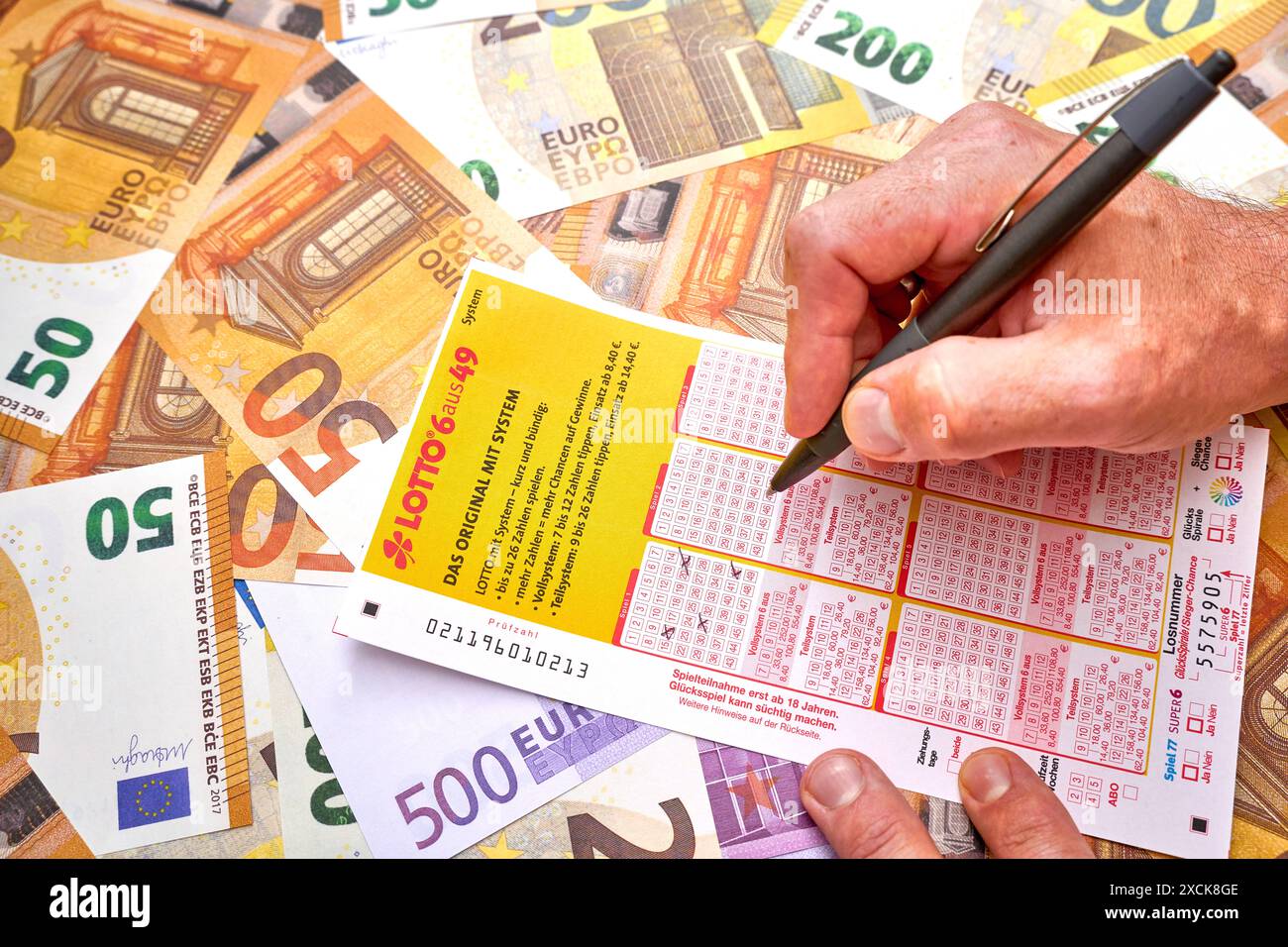 Germany - June 17, 2024: Lotto ticket Lotto 6 aus 49 with banknotes ...