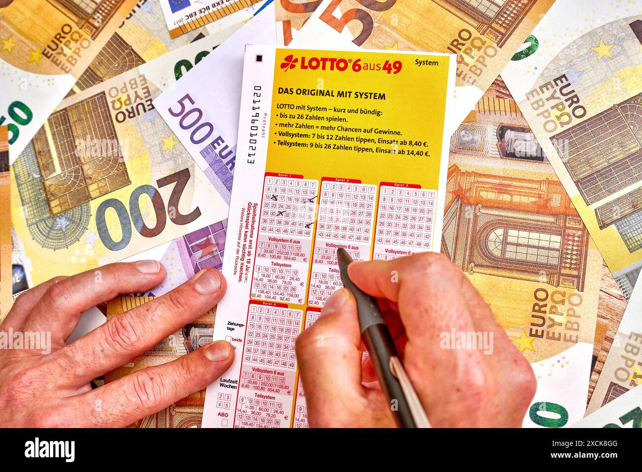 Germany - June 17, 2024: Lotto ticket Lotto 6 aus 49 with banknotes ...