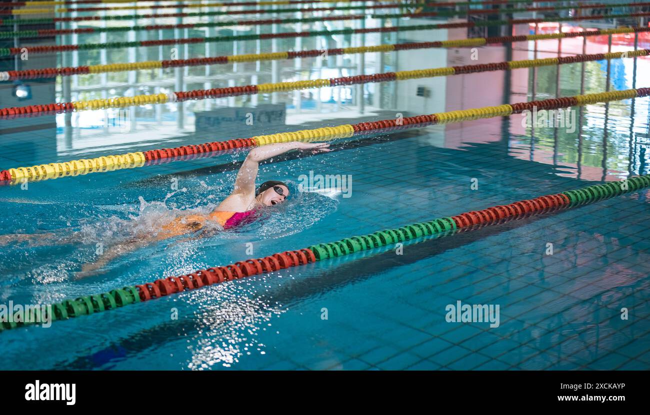 Elite female athlete, professional swimmer during a front crawl ...