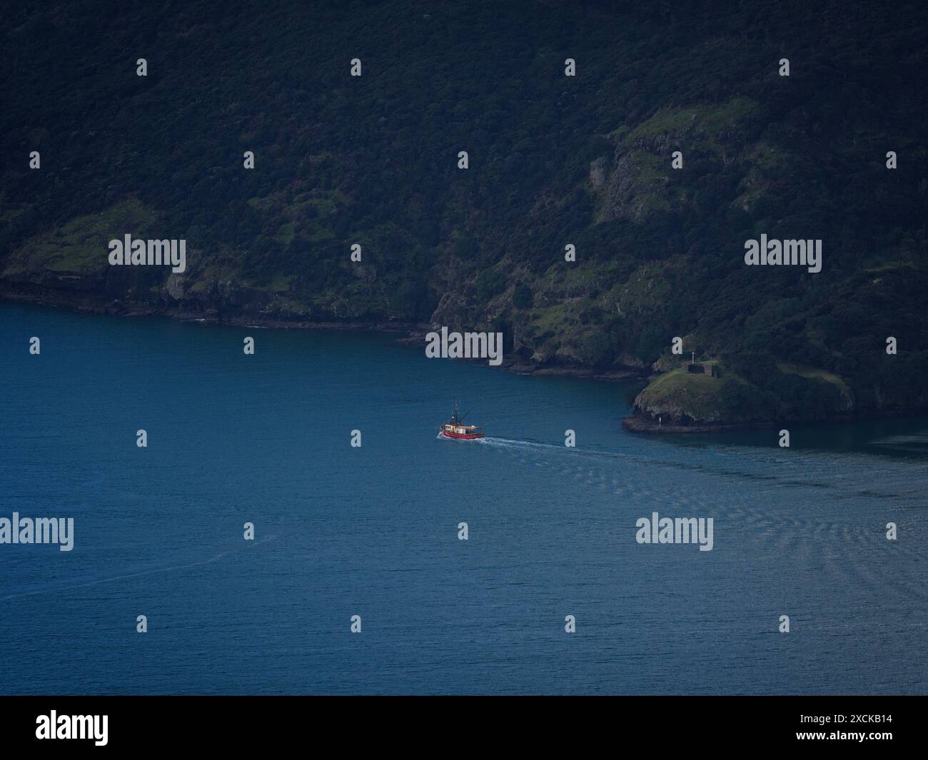 One lone fishing trawler boat ship cruising in blue ocean water of ...