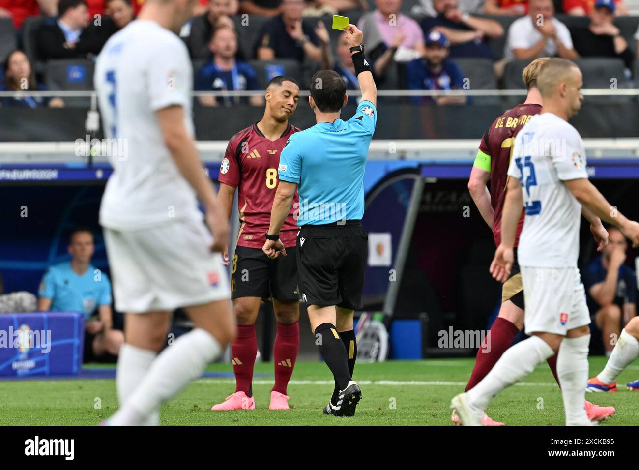 Youri Tielemans (8) of Belgium receives a yellow card from referee Umut ...