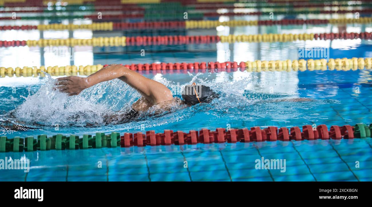 Elite female athlete, professional swimmer during a front crawl ...