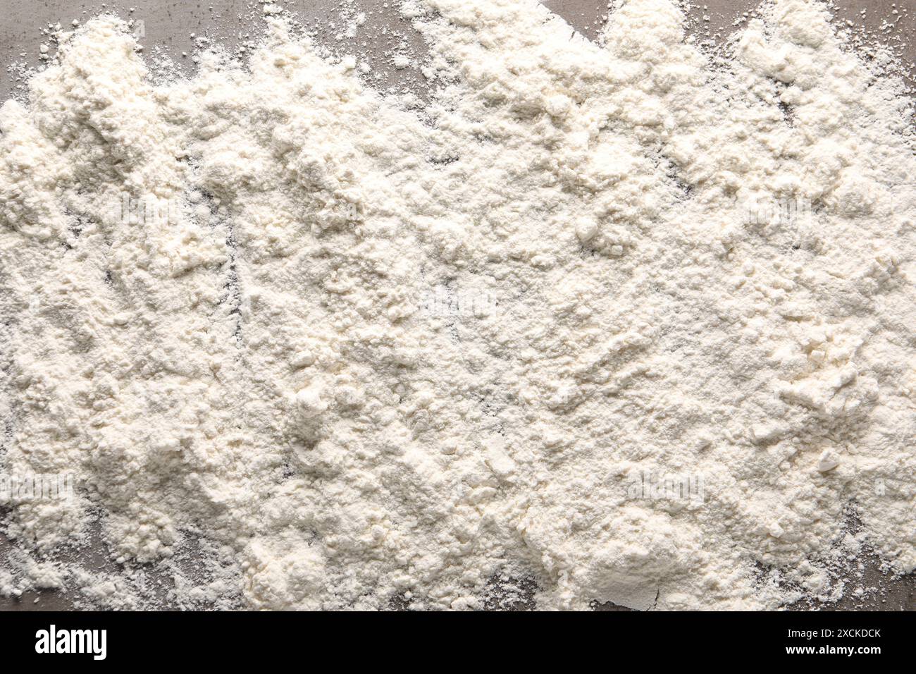 Scattered flour on grey table, top view Stock Photo - Alamy