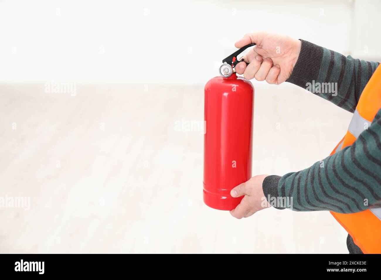 Man fire extinguishing hi-res stock photography and images - Alamy