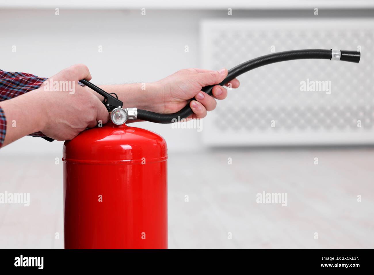 Man fire extinguishing hi-res stock photography and images - Alamy