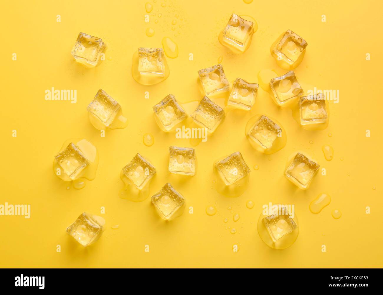 Crystal clear ice cubes on yellow background, flat lay Stock Photo - Alamy