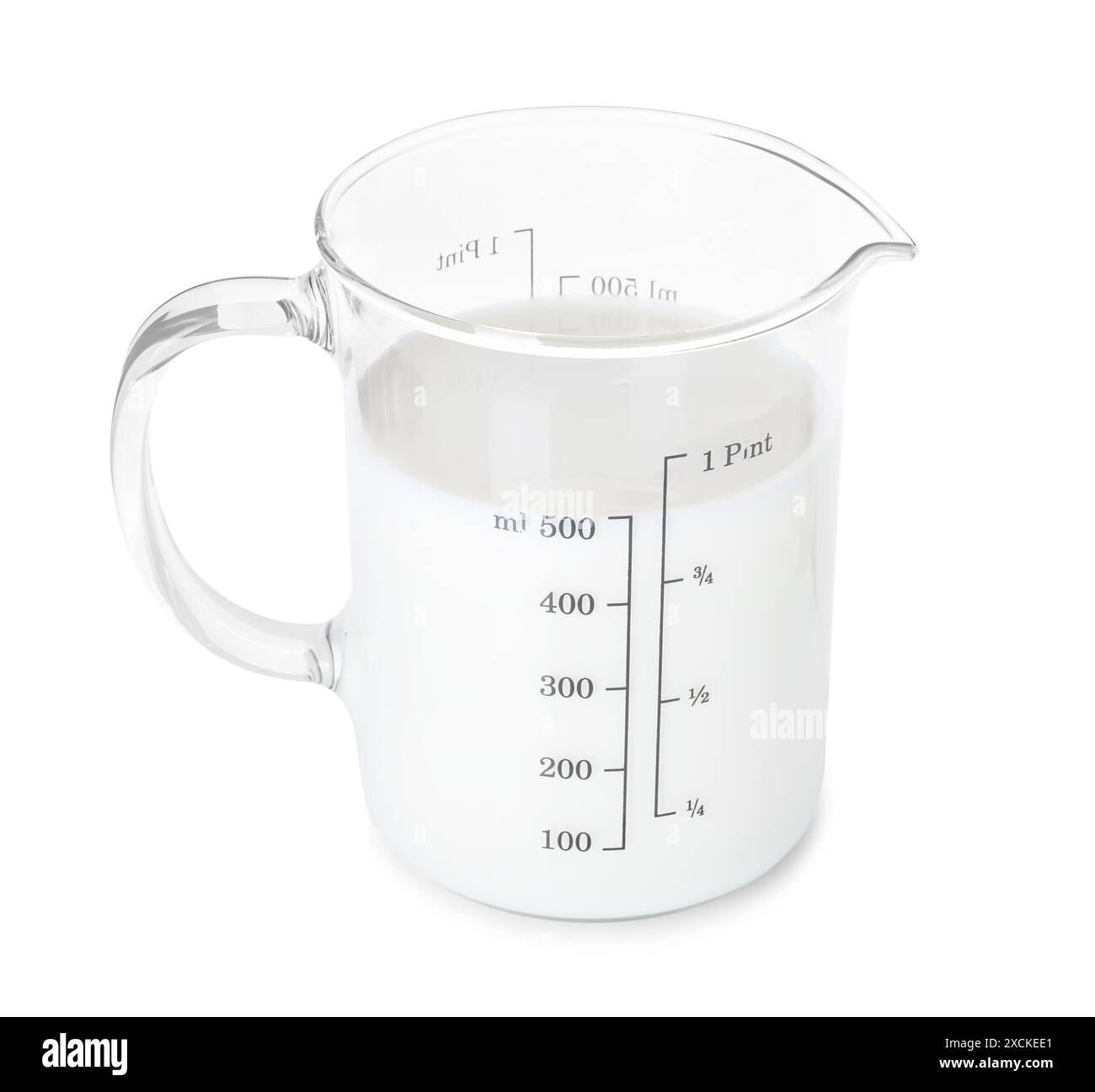 Fresh milk in measuring cup isolated on white Stock Photo - Alamy
