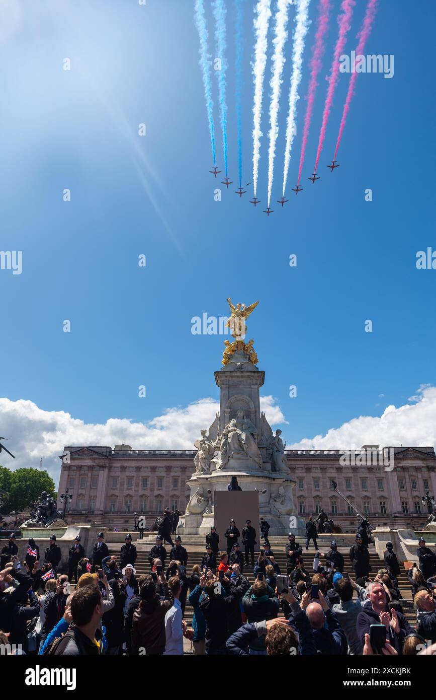 Royal Air Force Red Arrows display team flying over Buckingham Palace ...