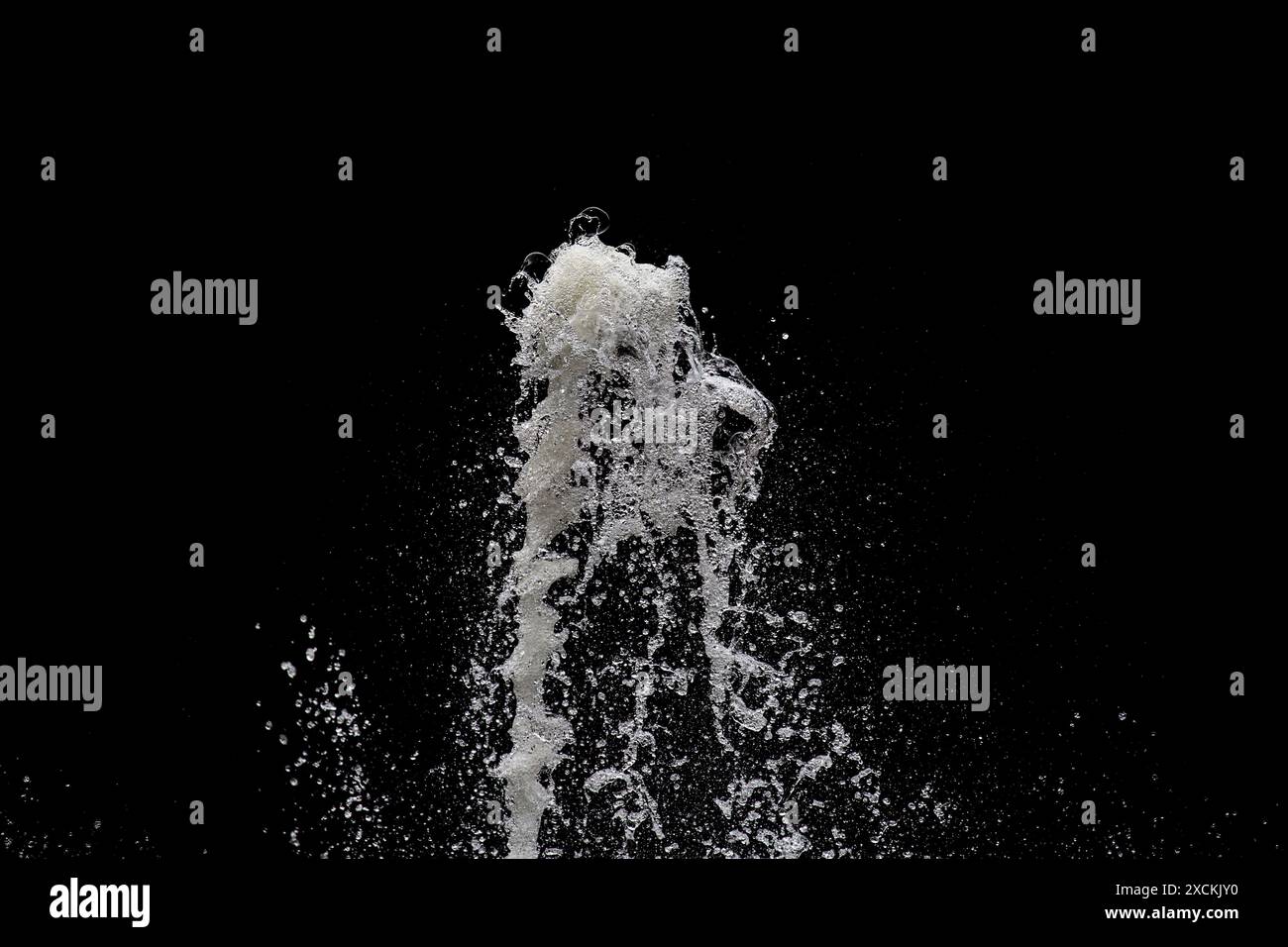 Water exploding into the air with a black background, horizontal Stock ...