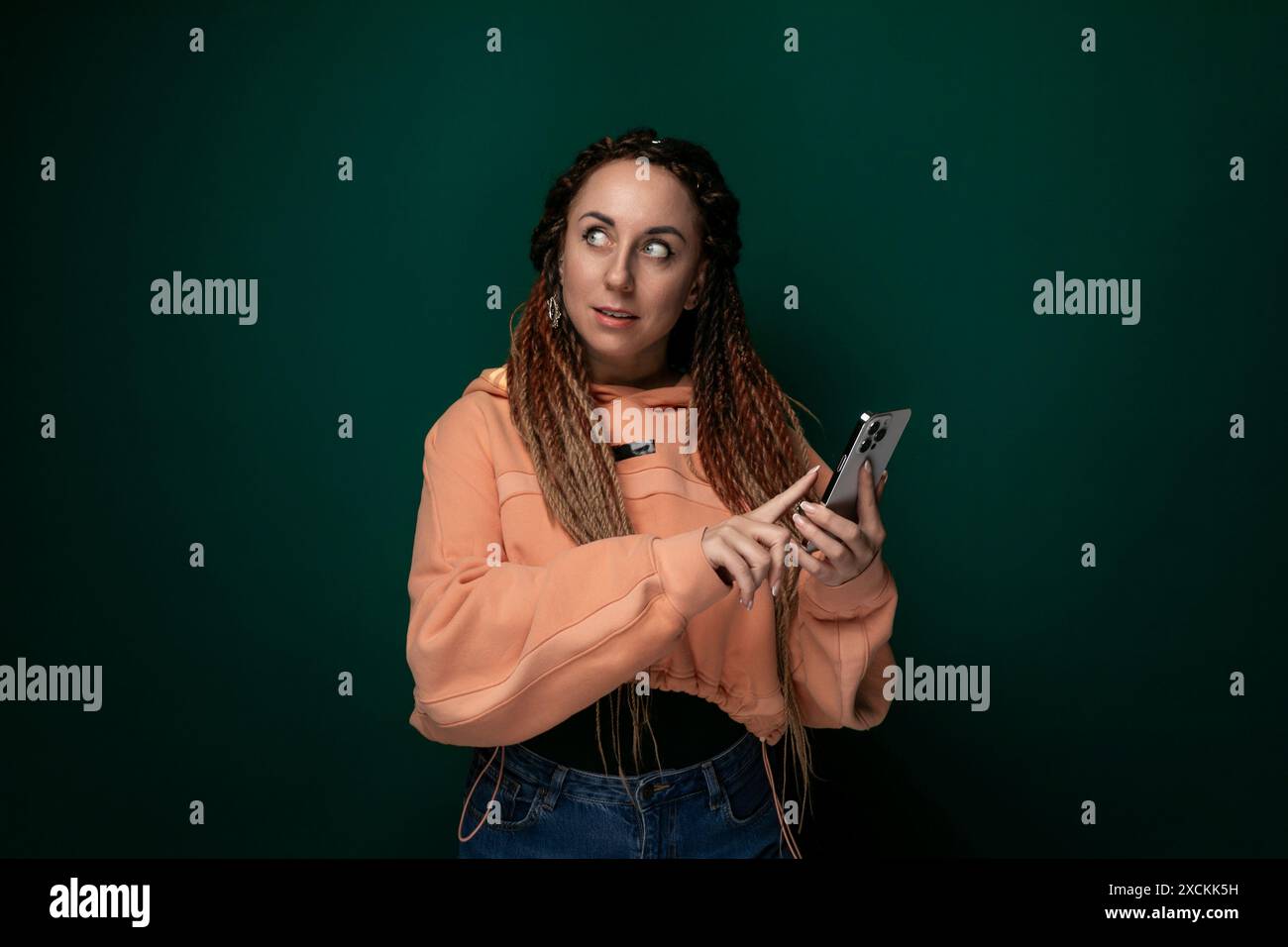 Woman dreadlocks holding cell hi-res stock photography and images - Alamy