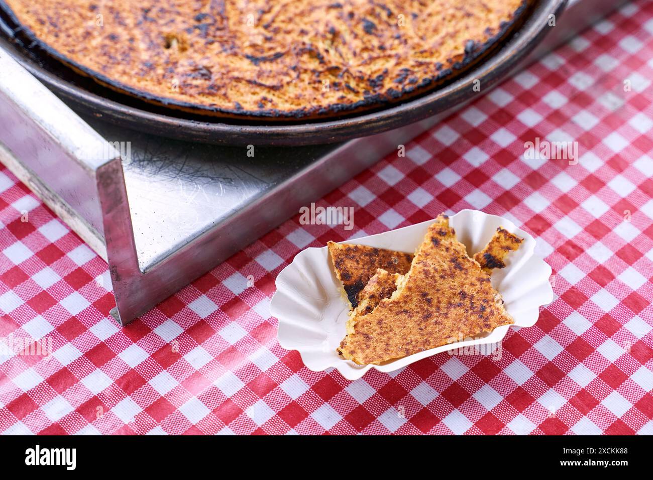 Socca, just coming out of the oven, in Nice, the French Riviera. a type ...