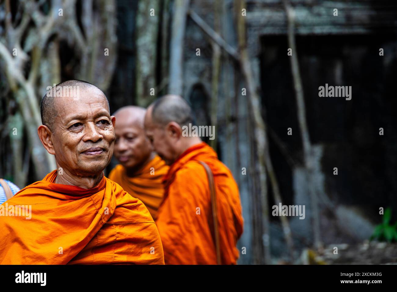 A group of monks were walking around an ancient temple in Cambodia ...