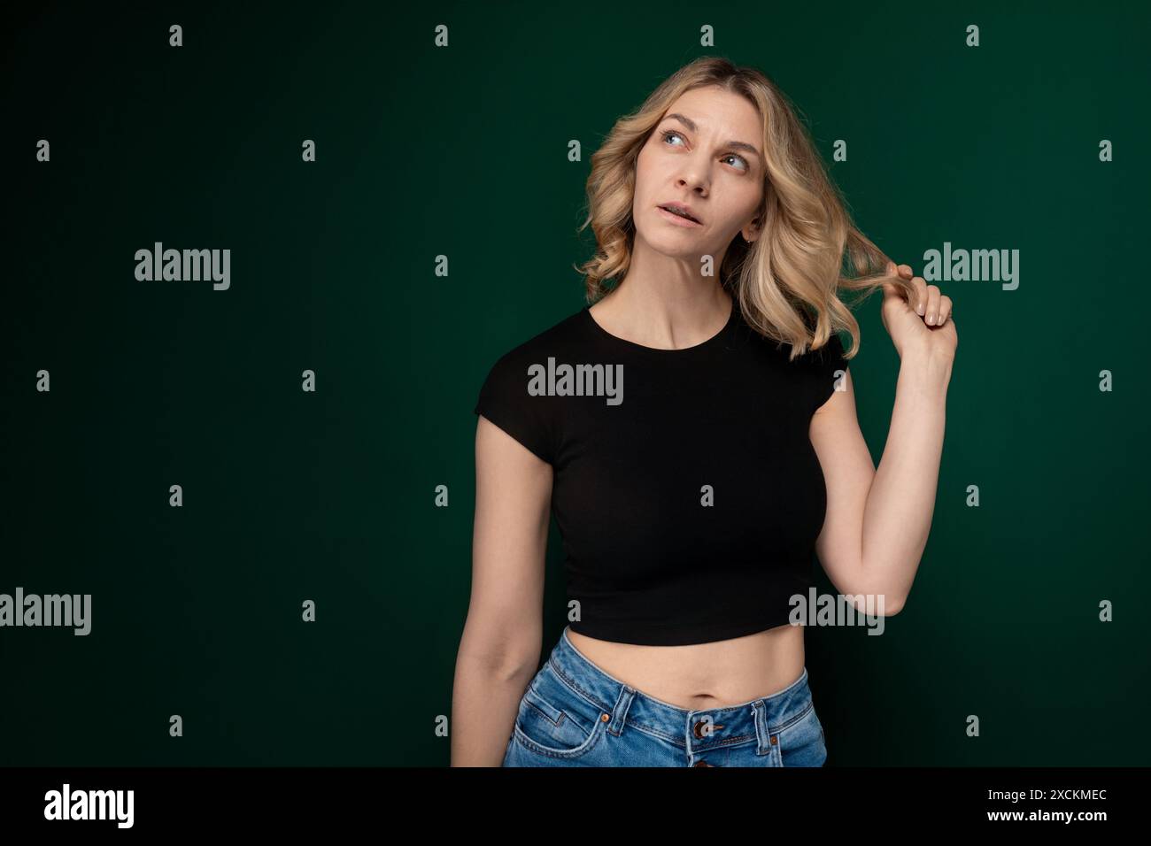 Woman in Black Top Posing for Picture Stock Photo - Alamy