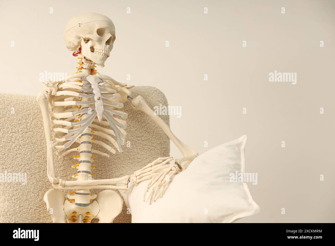 Waiting concept. Human skeleton sitting in armchair indoors Stock Photo ...