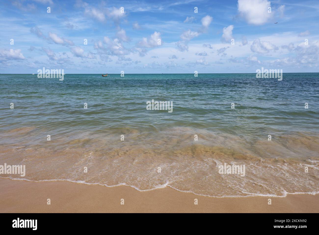 Empty sea sandy beach, picturesque view to emerald green waves and blue ...