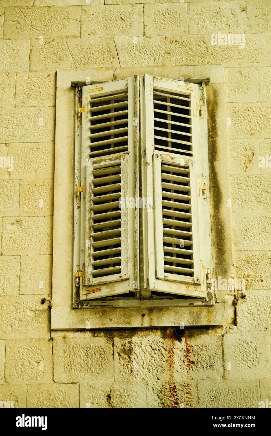 A window with two white slats and a white frame Stock Photo - Alamy
