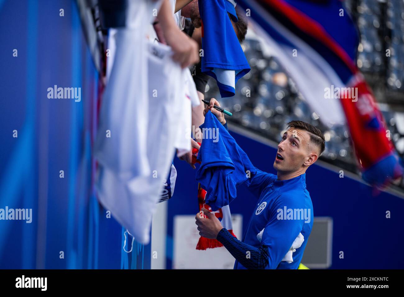 Robert Bozenik of, Slovakia. , . signs autographs after the UEFA Euro ...