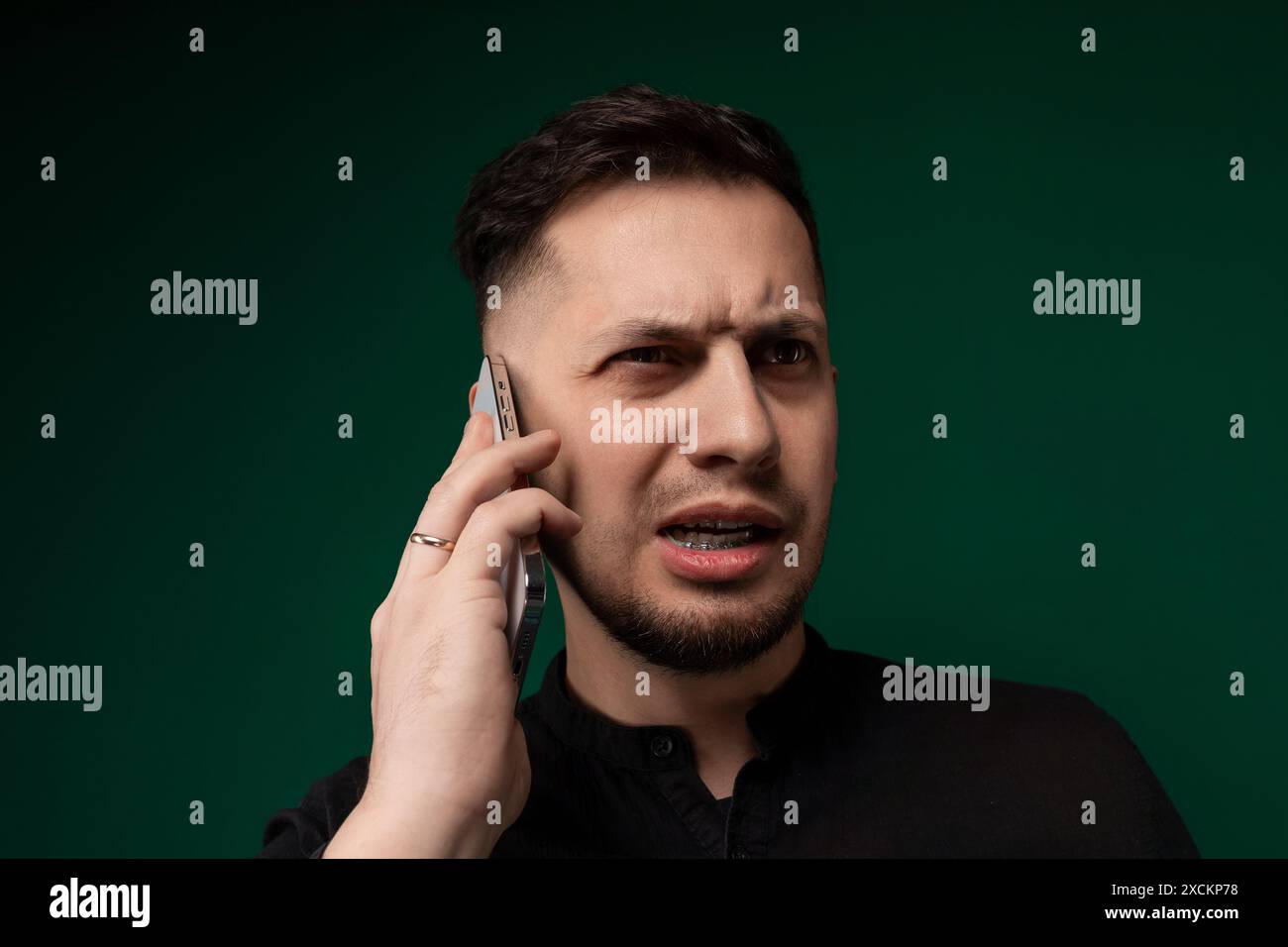 Man Holding Cell Phone to Ear Stock Photo - Alamy