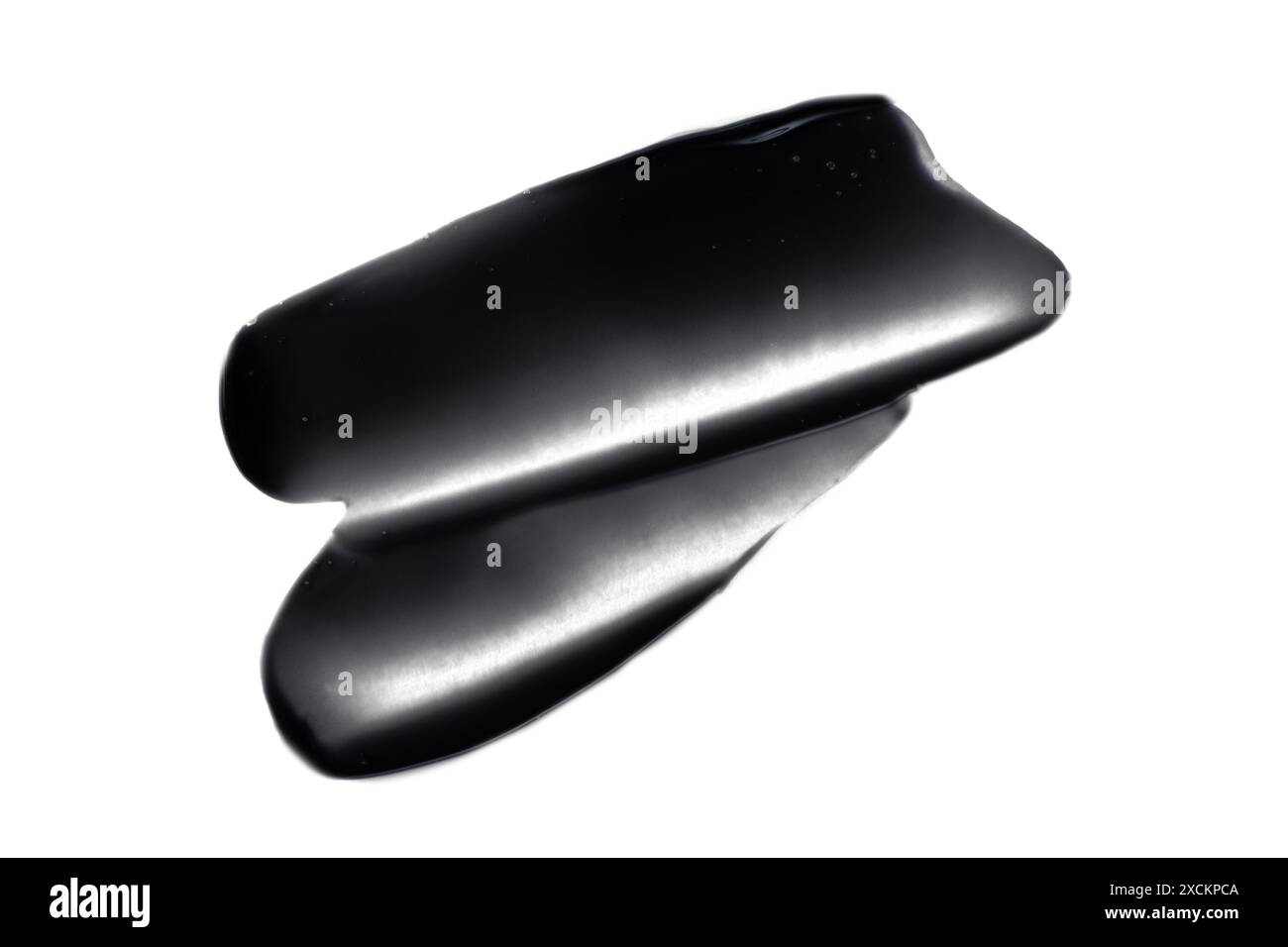 Black charcoal face mask smear isolated on white background. Abstract ...