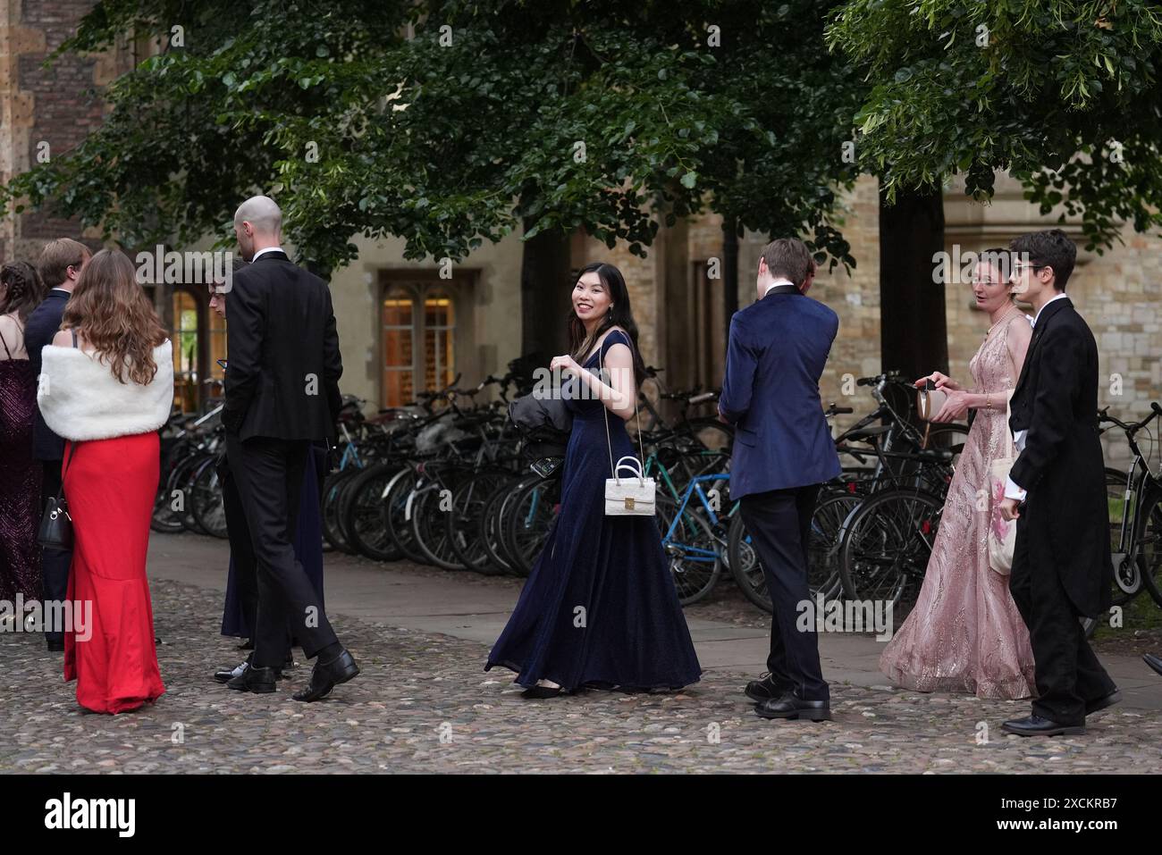 Students from Cambridge University queue up for the Trinity May Ball at ...
