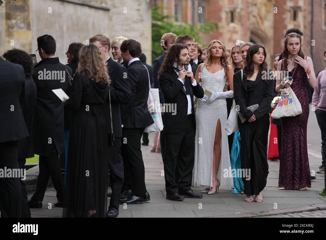 Students from Cambridge University queue up for the Trinity May Ball at ...