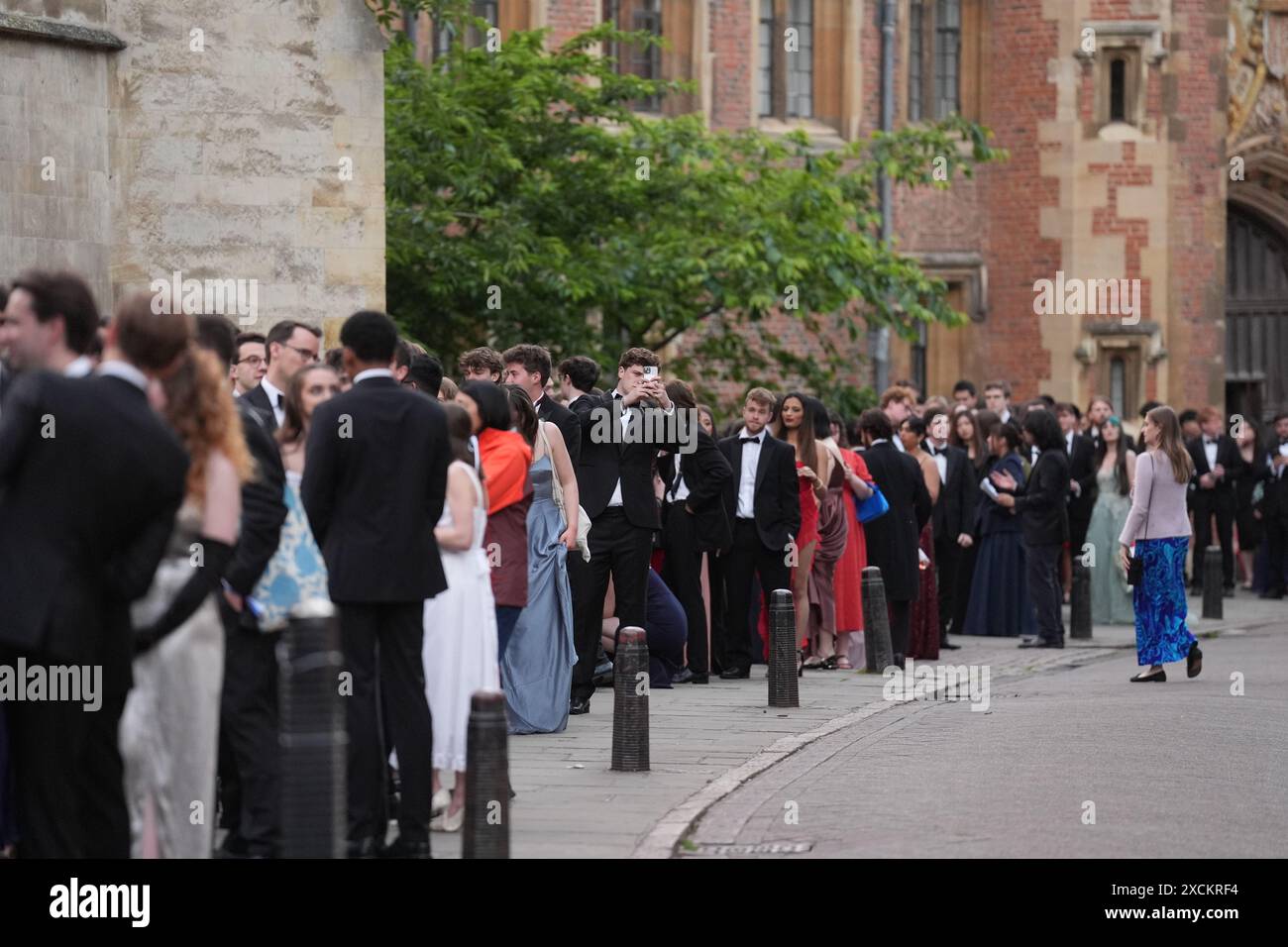 Students from Cambridge University queue up for the Trinity May Ball at ...