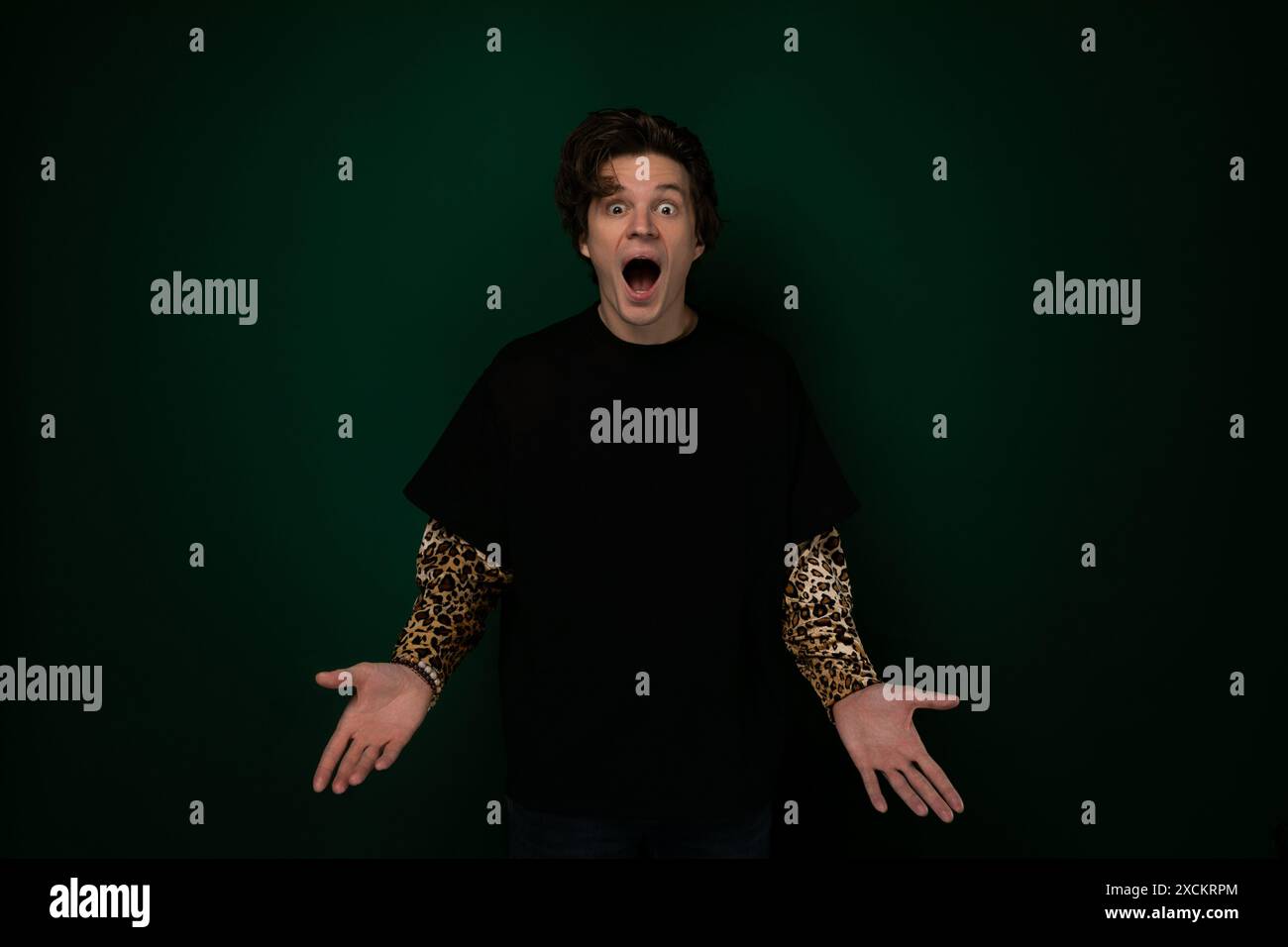 Man in Black Shirt Making Surprised Face Stock Photo - Alamy