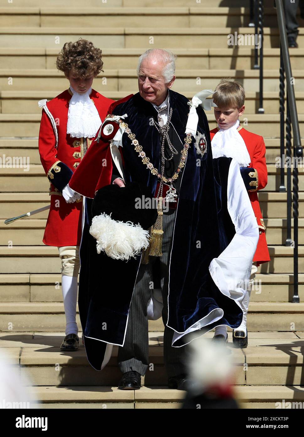 King Charles III is followed by Page of Honour Charles van Cutsem (left ...