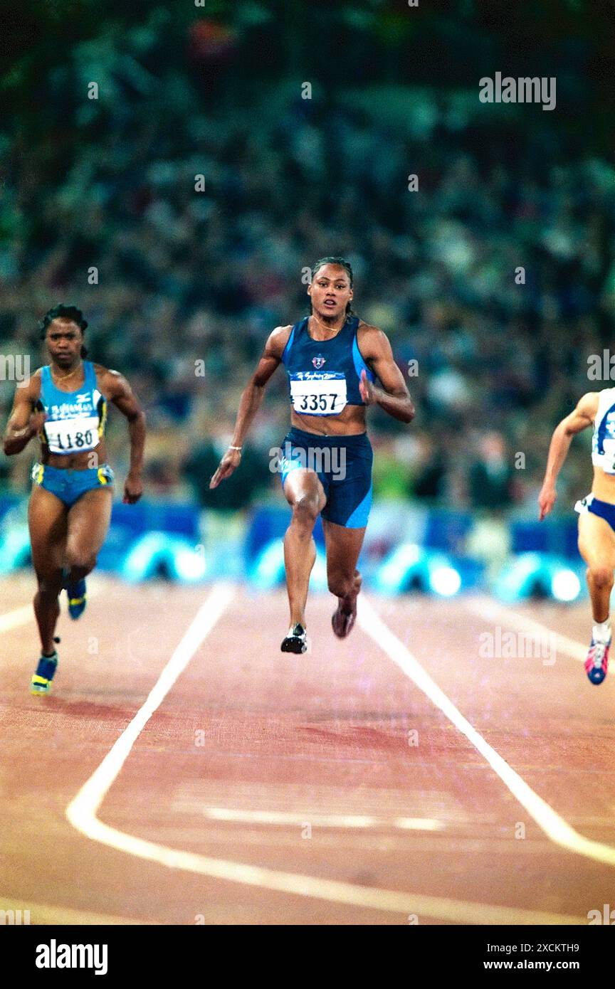Marion Jones (USA) wins the gold medal in the women's 100m at the 2000 ...