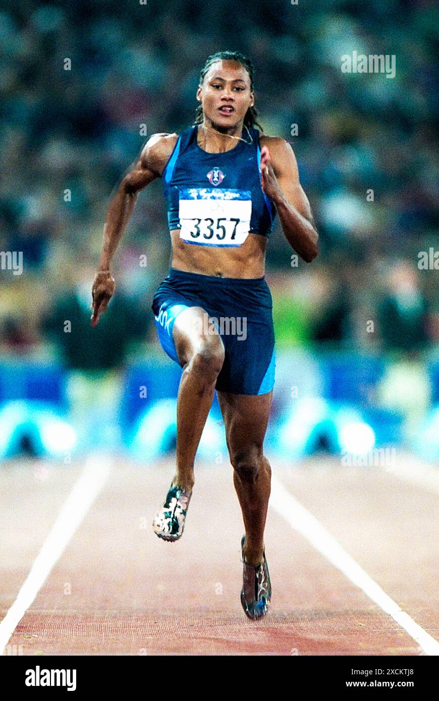 Marion Jones (USA) wins the gold medal in the women's 100m at the 2000 ...