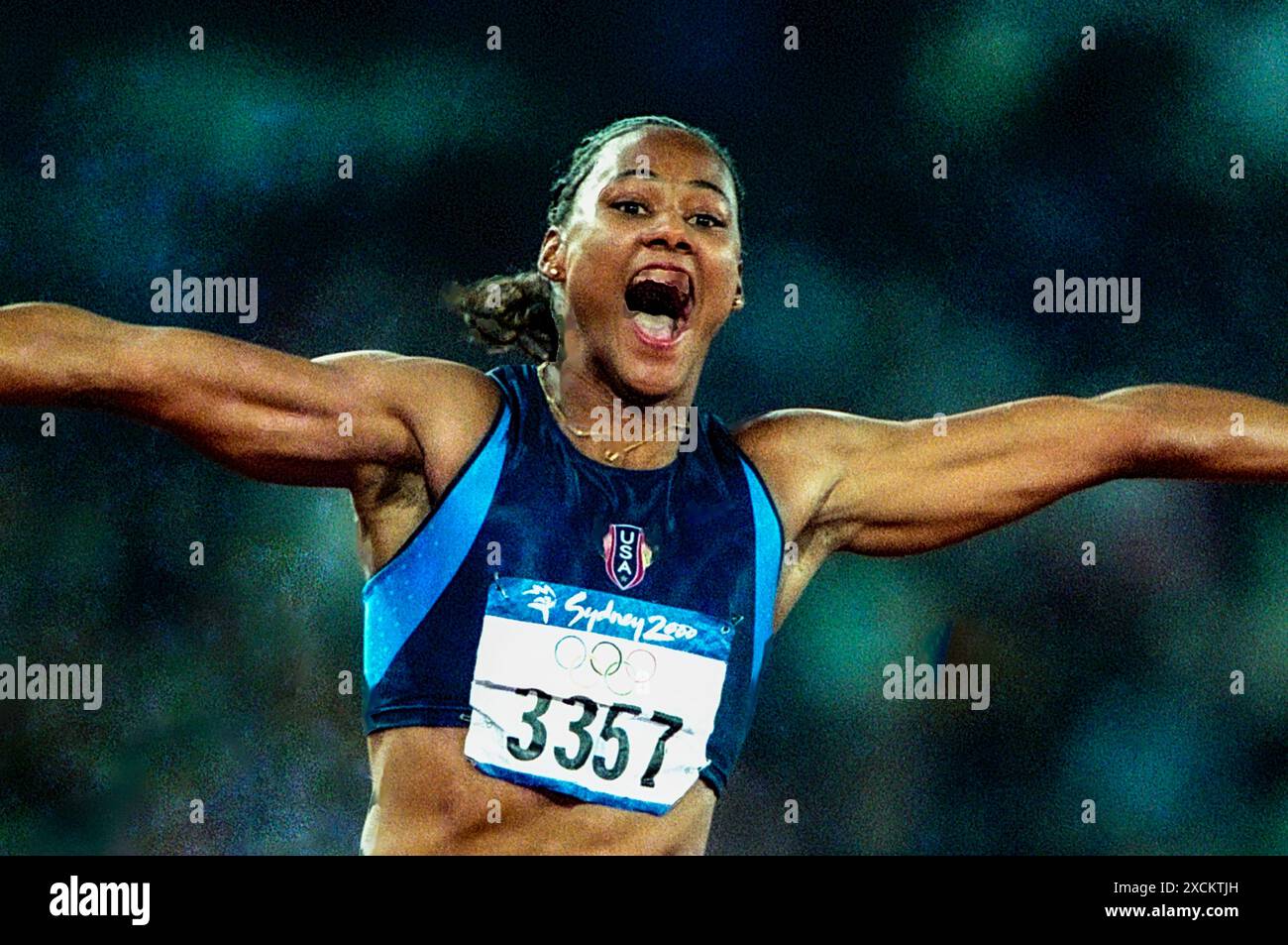 Marion Jones (USA) wins the gold medal in the women's 100m at the 2000 ...