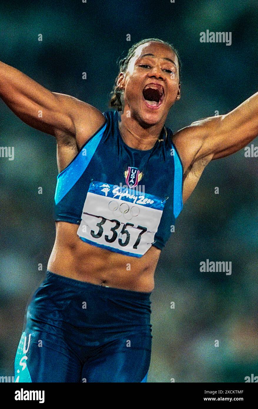 Marion Jones (USA) wins the gold medal in the women's 100m at the 2000 ...