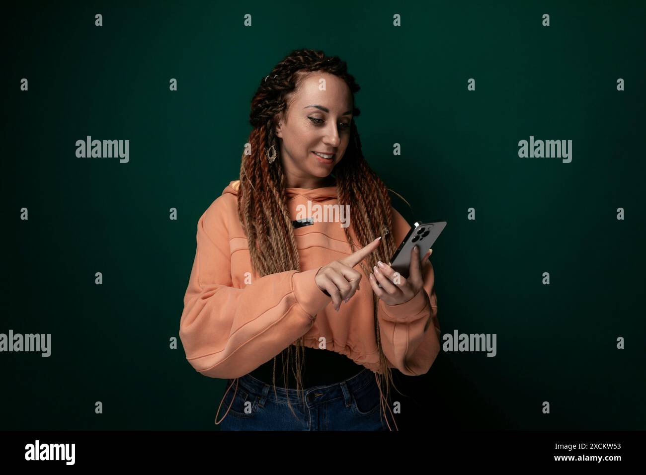 Woman With Dreadlocks Using Cell Phone Stock Photo - Alamy
