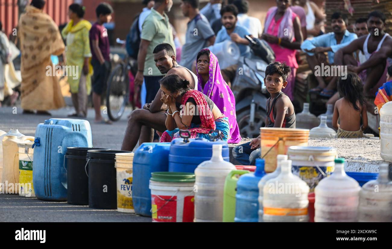 NEW DELHI, INDIA - JUNE 17: People seen waiting for water tankers amid ...