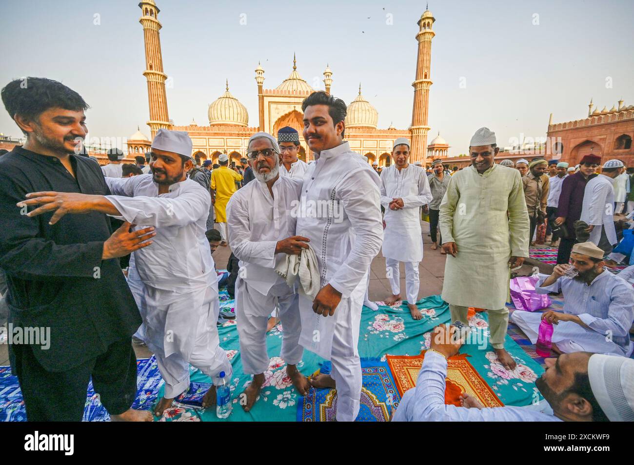 NEW DELHI, INDIA - JUNE 17: Muslims embrace after offering Eid al-Fitr ...