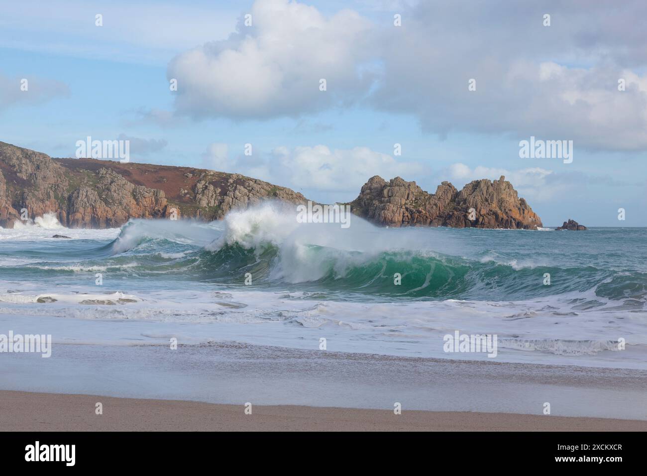 High tide at Porthcurno Beach; Logan's Rock, Cornwall Stock Photo - Alamy