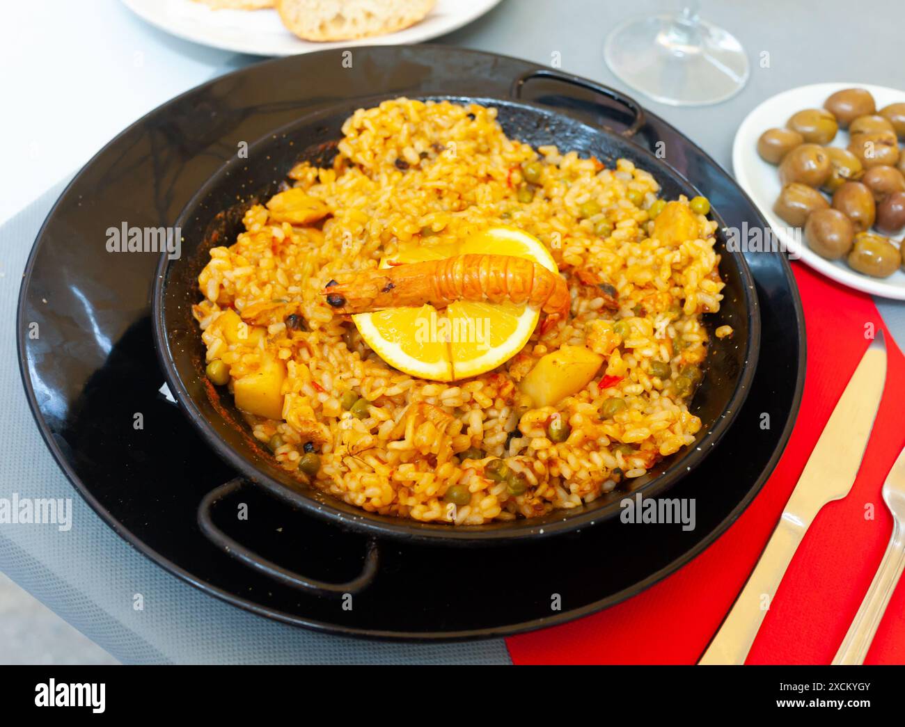 Spainsh dish seafood paella with rice, shrimps and mussels Stock Photo ...