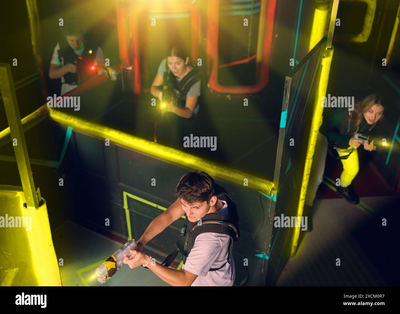 Team of young people play laser tag in labyrinth. View from above Stock ...