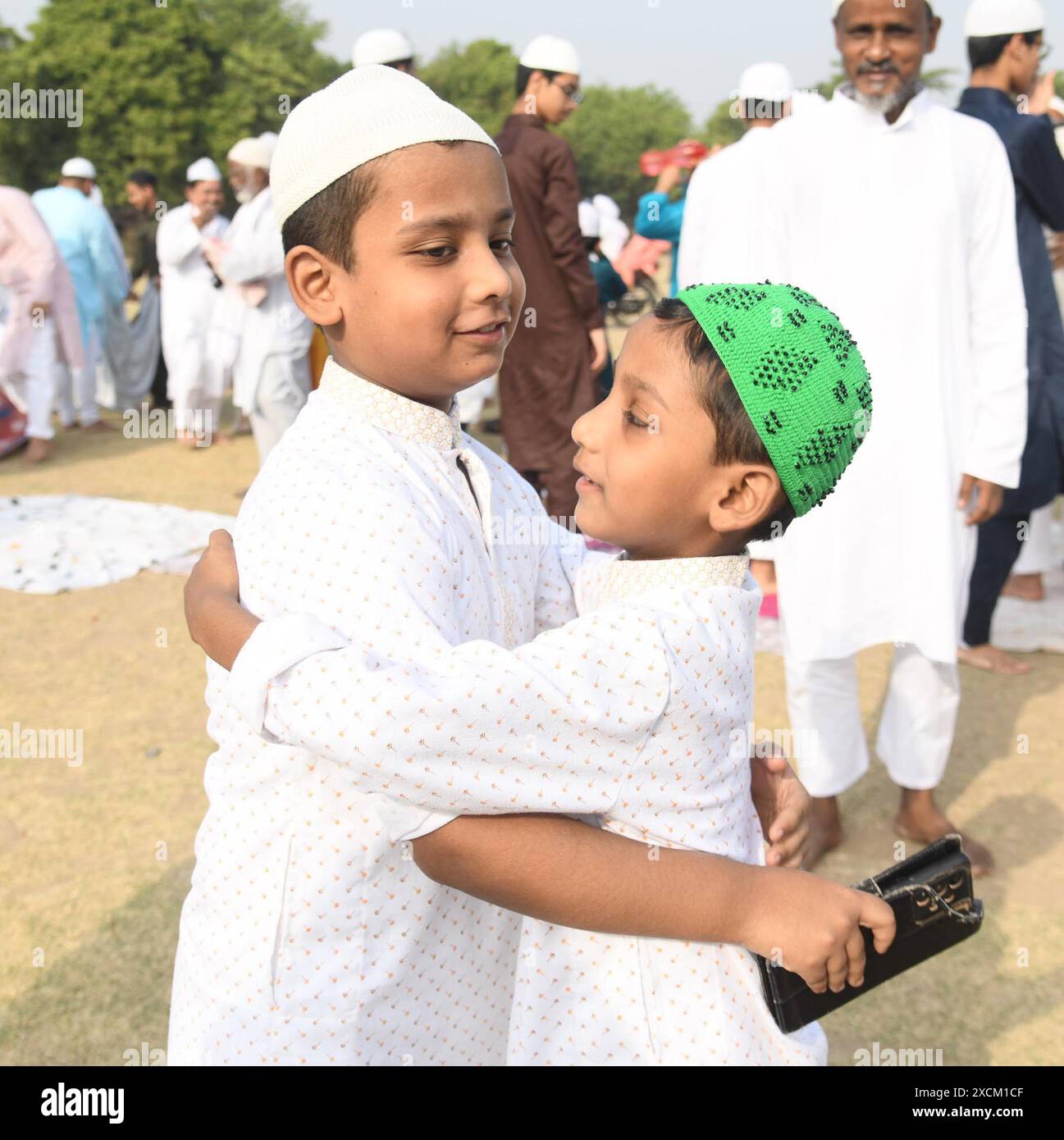 PATNA, INDIA - JUNE 17: Muslim children giving congratulations to each ...