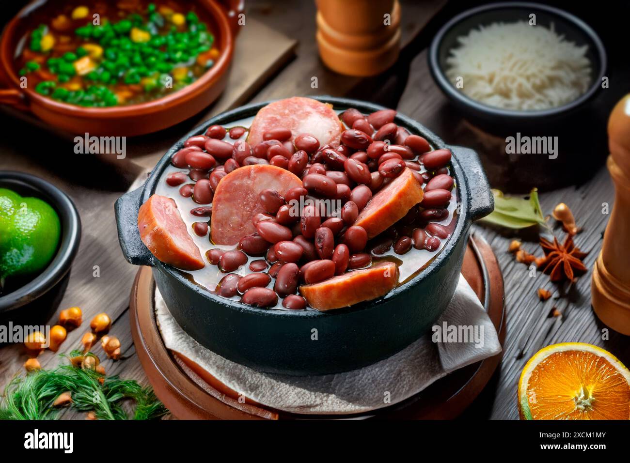 Feijoada traditional Brazilian food served with rice, farofa, orange ...
