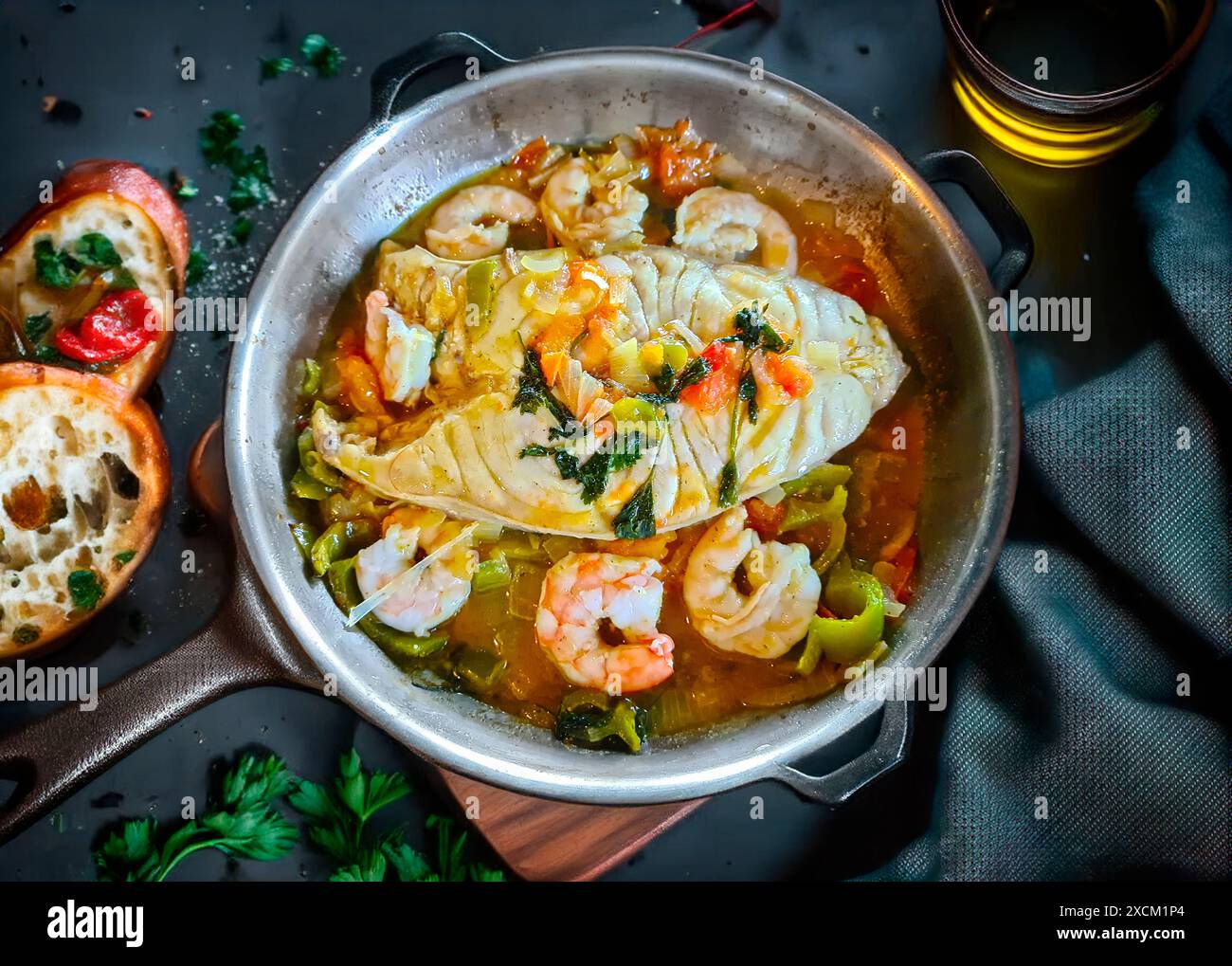 Moqueca, a traditional Brazilian dish with badejo fish and large shrimp ...