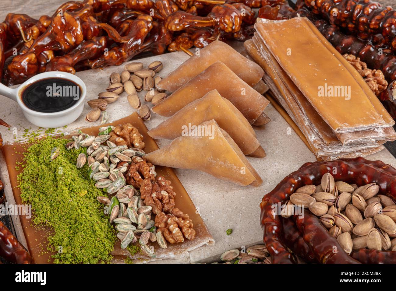 Turkish cuisine various snacks. Walnut sausage, pistachio sausage and ...
