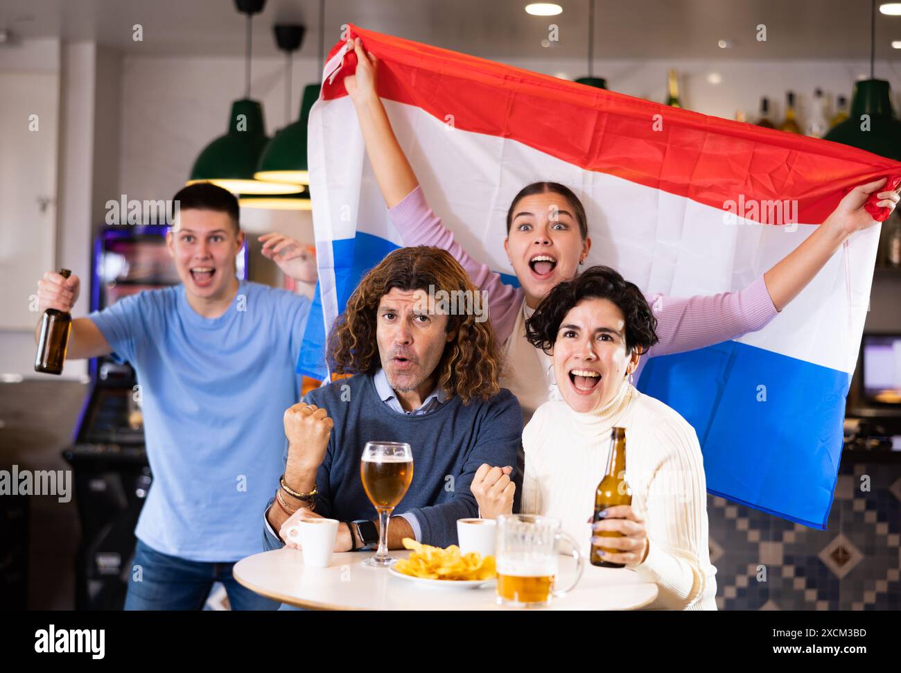 Group of friends sports supporters cheering for favorite team with flag ...