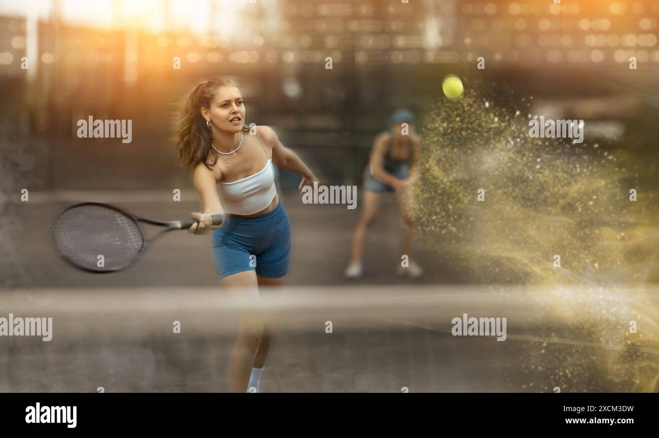 Stylized Shot Of Young Female Tennis Player Swinging Racket To Hit Ball