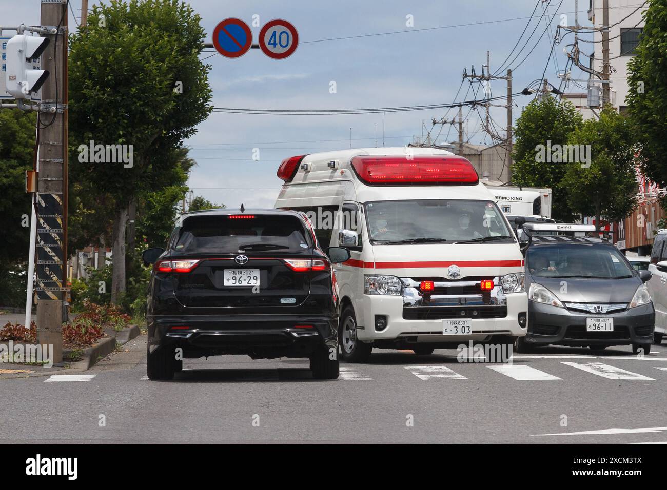 A Japanese ambulance weaving through traffic near Sagamihara, Kanagawa ...