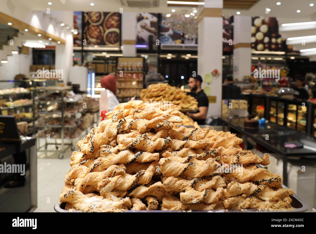 Baghdad, Iraq. 17th June, 2024. Traditional sweets are displayed during ...